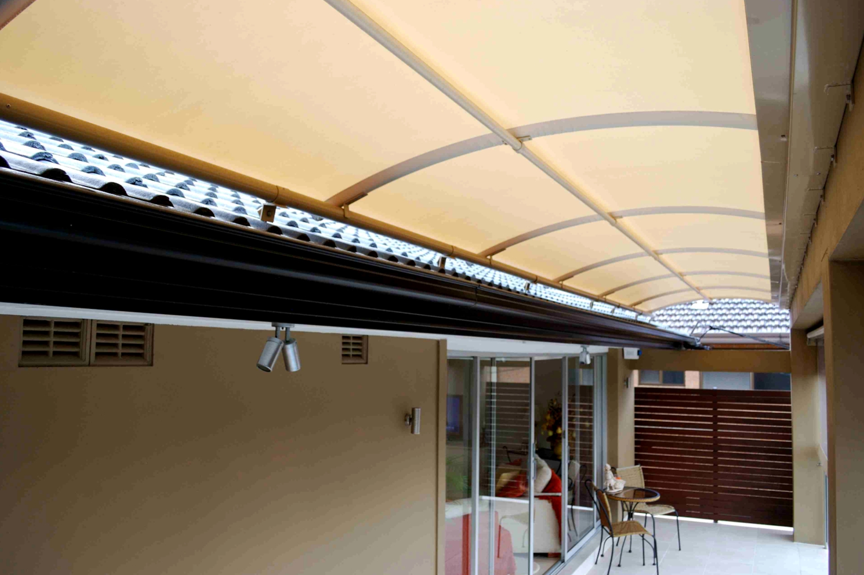Curved batten awnings | Custom made. Fixed and retractable.