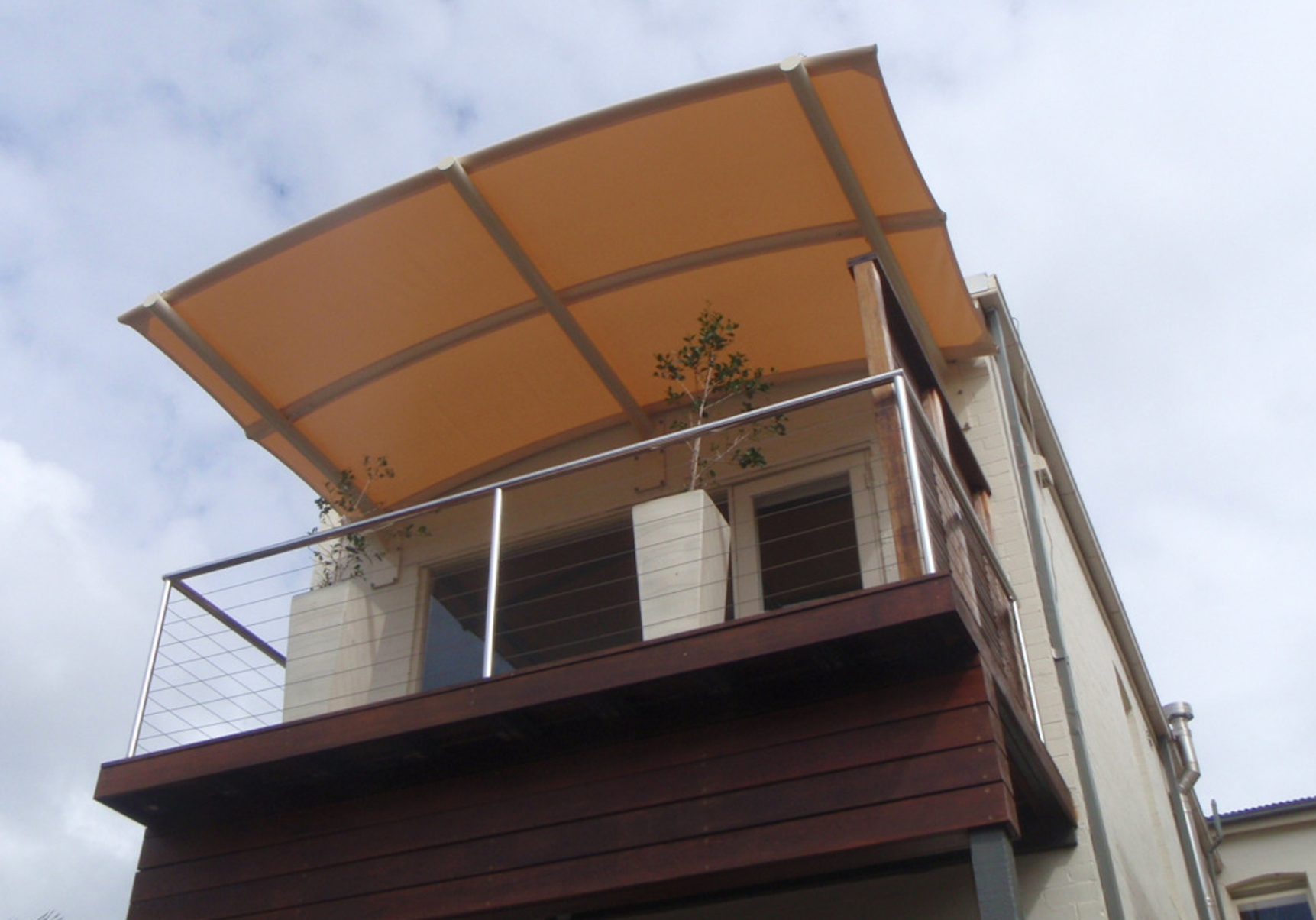 Curved batten awnings | Custom made. Fixed and retractable.